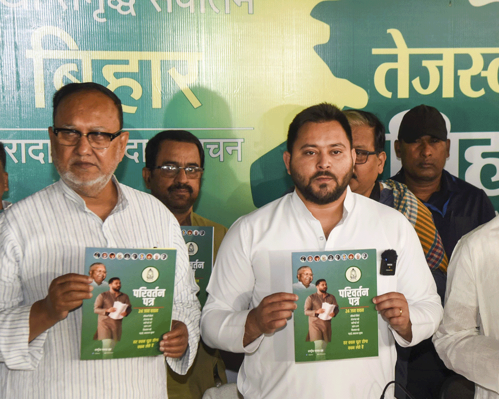 RJD releases poll manifesto; promises 1 crore govt jobs, Rs 1 lakh to poor 'sisters'